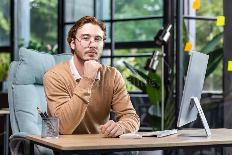 Portrait of Thinking Serious Man with Computer Inside Modern Green Loft ...