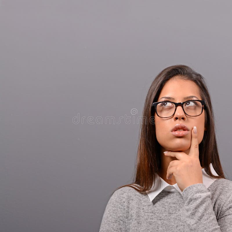 Portrait of Thoughtful Business Woman Against Gray Background Stock ... Portrait of Thoughtful Business Woman Against Gray Background Stock ...