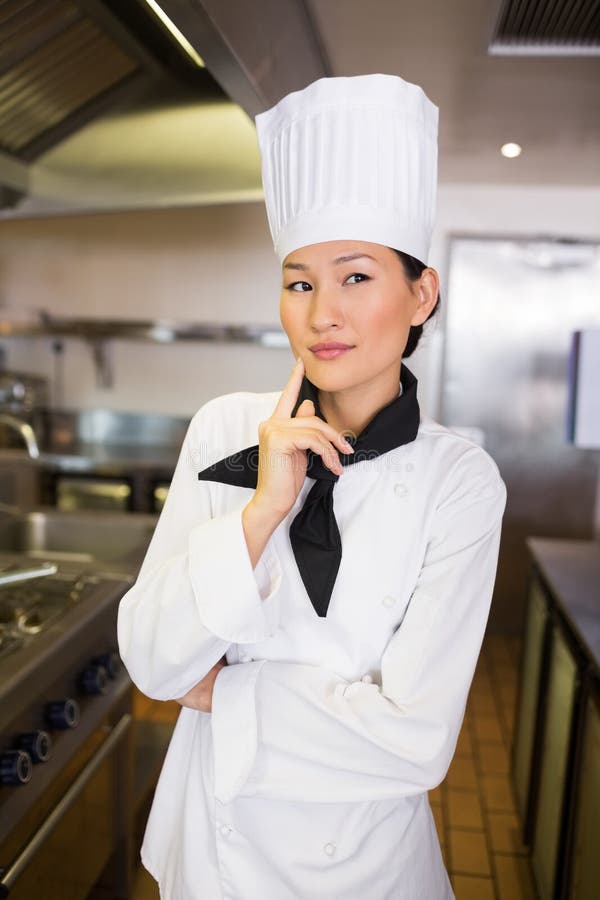 Portrait of Thoughtful Female Cook in Kitchen Stock Photo - Image of ...