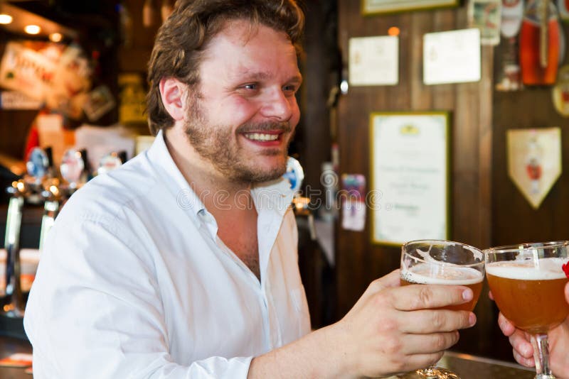 Portrait of Thoughtful Men Drinking Beer at the Pub Stock Photo - Image ...