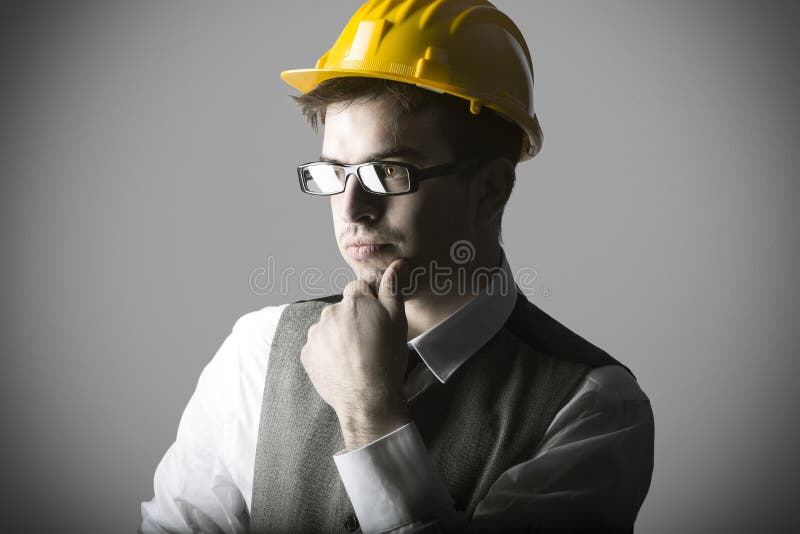 Portrait of Thoughtful Smart Young Engineer Stock Image - Image of grey ...