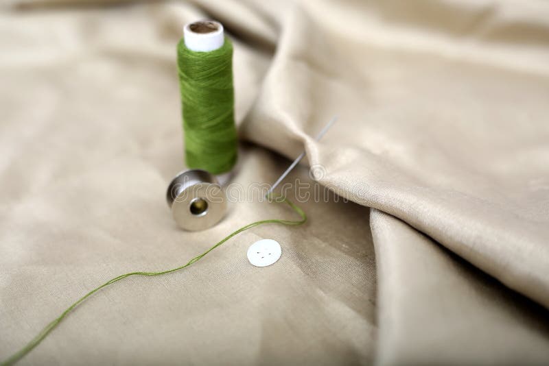 Portrait of Thread and Needle Attached in Cloth with Green Sewing ...