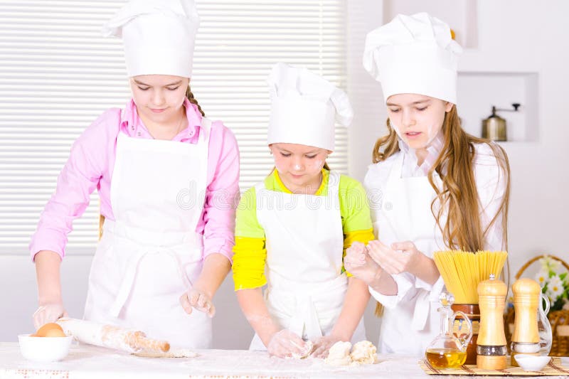 Portrait of Three Cute Girls Cooking on Kitchen Stock Image - Image of ...