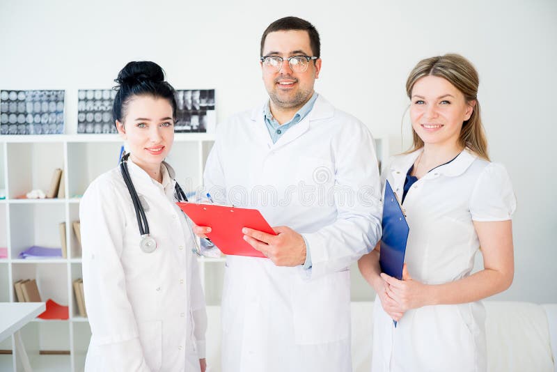 Portrait of three doctors stock photo. Image of person - 91391766