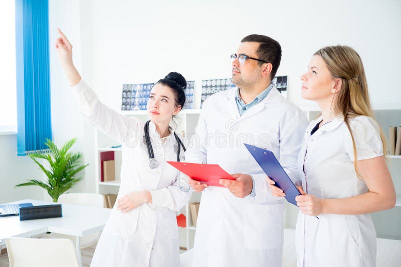 Portrait of three doctors stock photo. Image of confident - 91392350