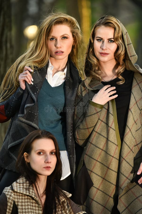 Portrait of Three Elegant Young Women Posing Outdoors Stock Photo ...