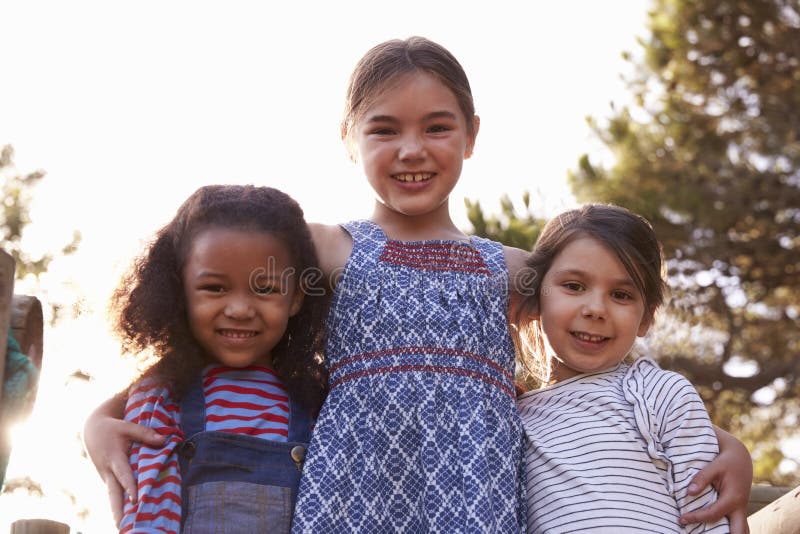 Portrait of Three Girls Playing Outdoors at Home in Garden Stock Photo ...