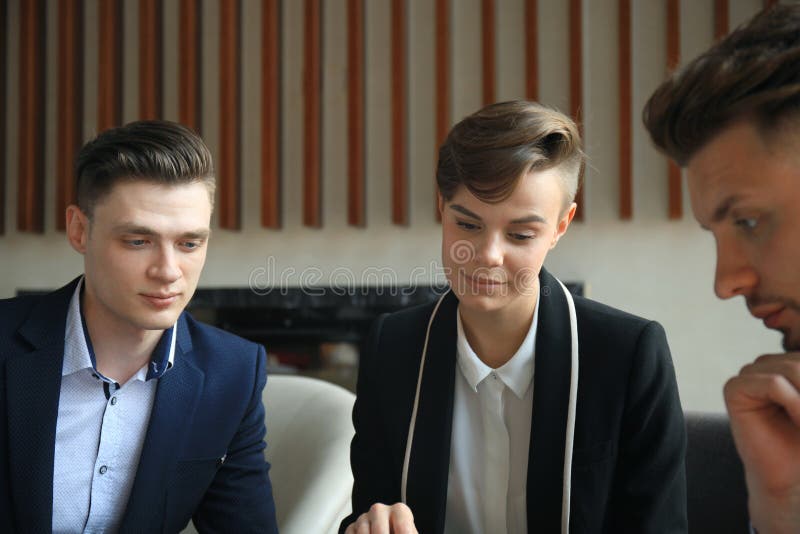 Portrait of Three Partners Discussing Ideas at Meeting. Stock Photo ...