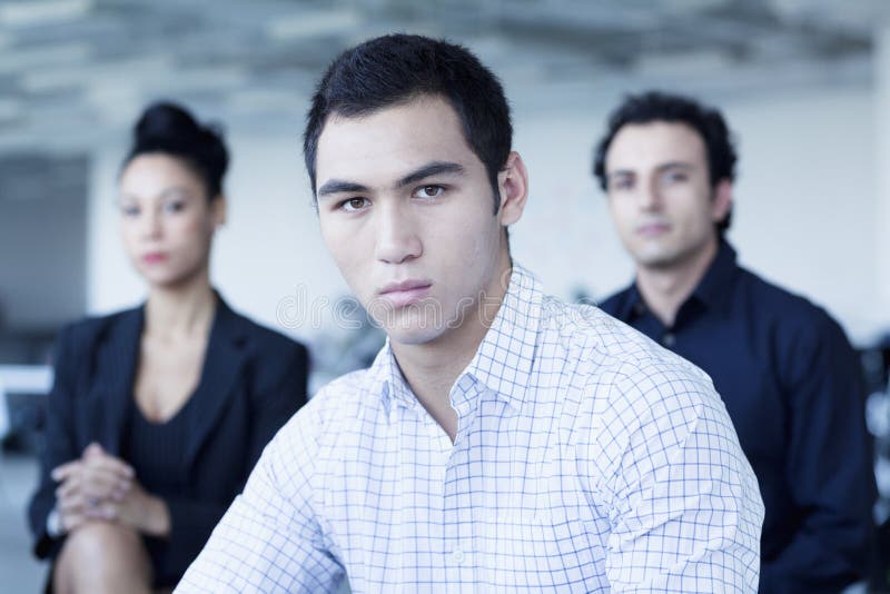 Portrait of Three Serious Business People in the Office Stock Photo ...