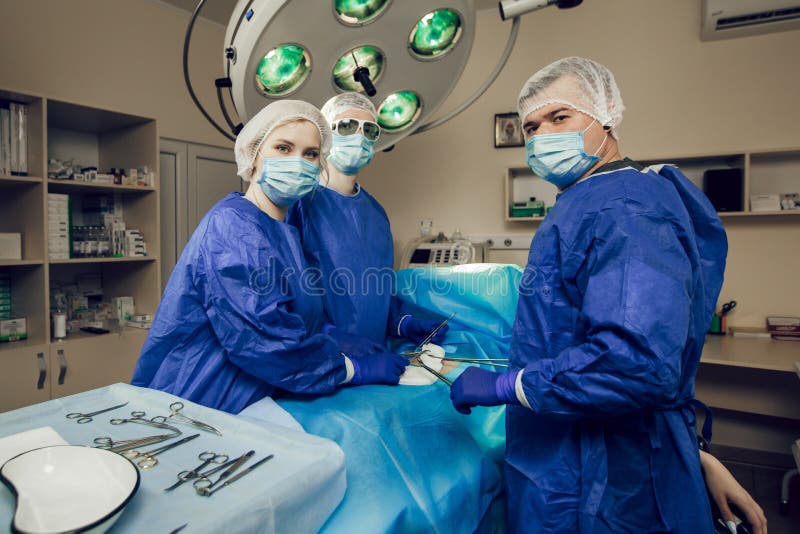 Portrait of Three Surgeons at Work. Doctors are Preparing for Surgery ...