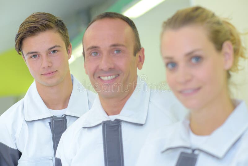 Workers with One in the Foreground Stock Image - Image of team ...