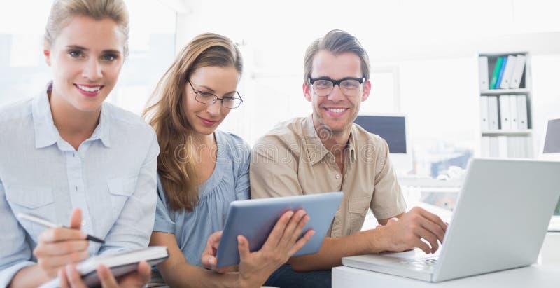 Portrait of Three Young People in Office Stock Image - Image of woman ...