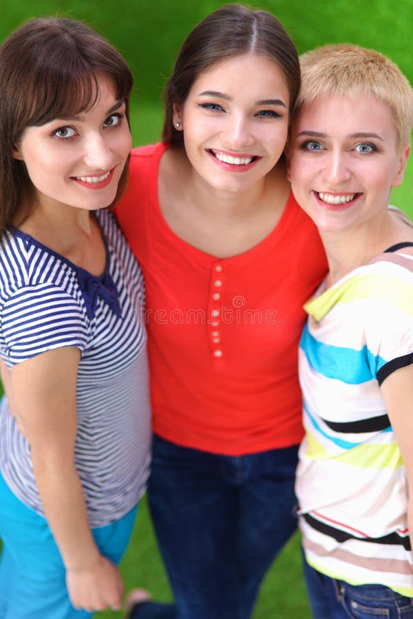Portrait of Three Young Women, Standing Together Stock Photo - Image of ...