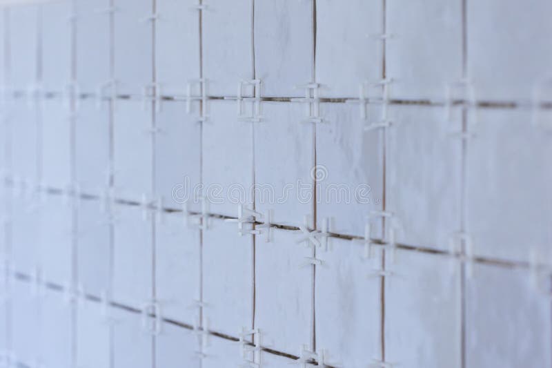 A Portrait of a Tile Wall Under Construction. the Wall is Being Tiled ...