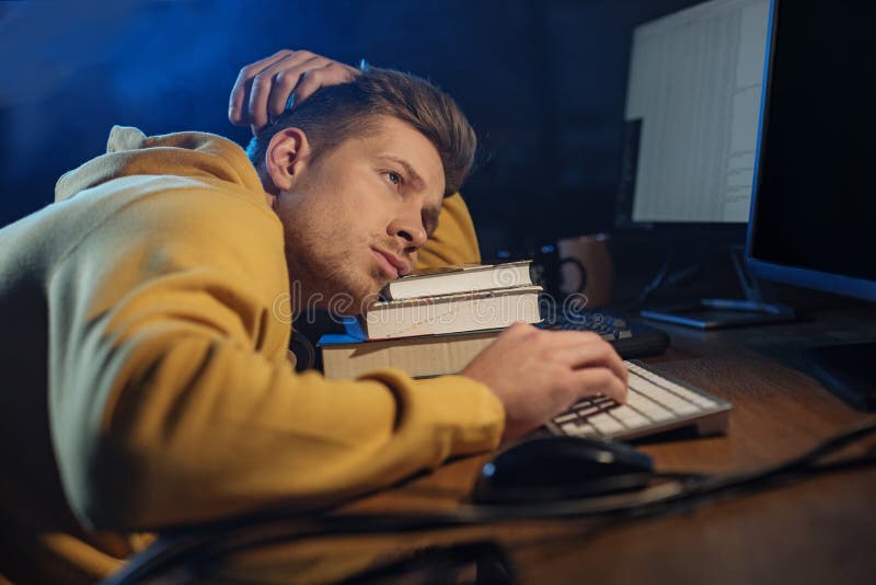Weary man lying on manuals stock photo. Image of apartment - 108585934