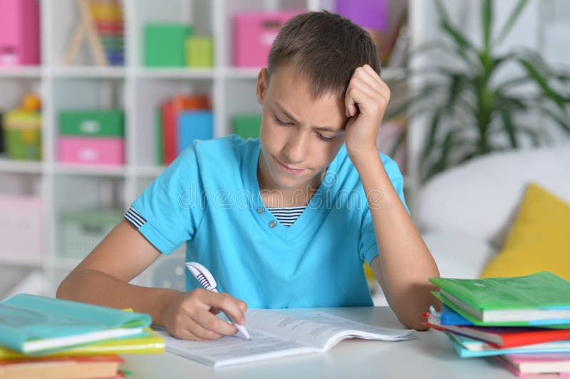 Portrait of Tired Boy Doing Homework at Home Stock Photo - Image of ...