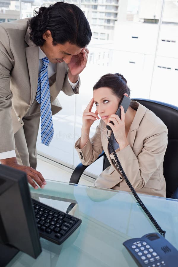 Portrait of a Tired Business Team on the Phone Stock Photo - Image of ...
