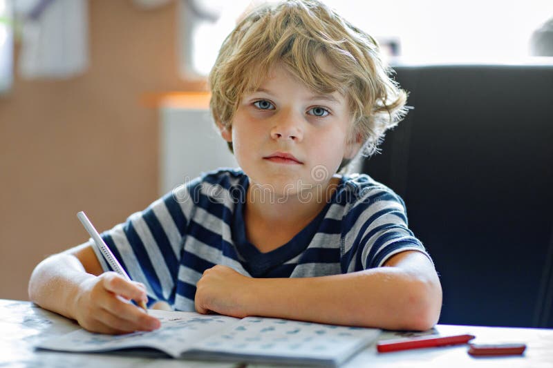 Portrait of Tired Upset Boy Doing Homework in Kitchen at Home ...