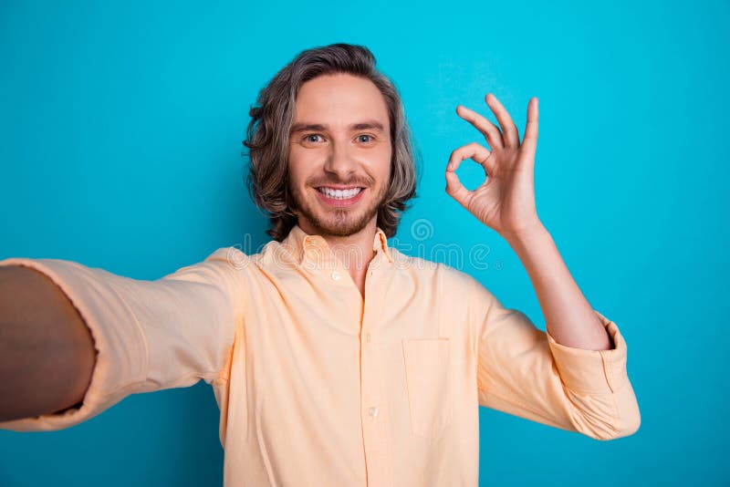 Portrait Of Toothy Beaming Nice Guy With Long Haircut Wear Stylish Shirt Making Selfie Showing