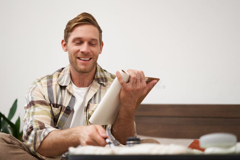 Portrait of Tourist Packing Suitcase, Going through Check-list, Writing ...