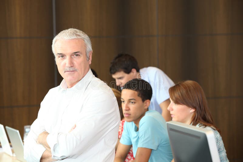 Portrait of a Trainer in Classroom Stock Image - Image of computer ...