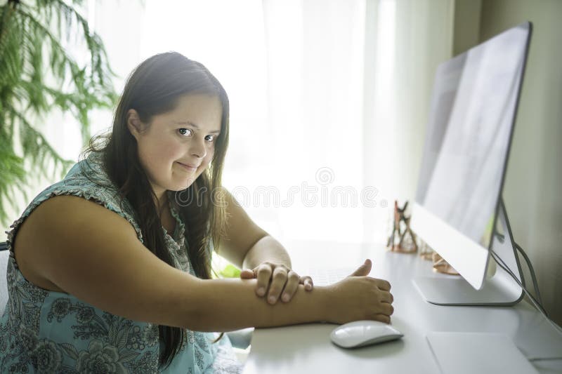 Portrait of Trisomy 21 Adult Working on Computer Stock Image - Image of ...
