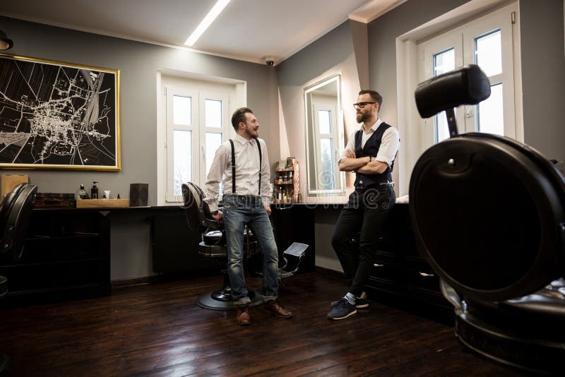 Two Barbers Talking in Salon Stock Photo - Image of inside, beard ...