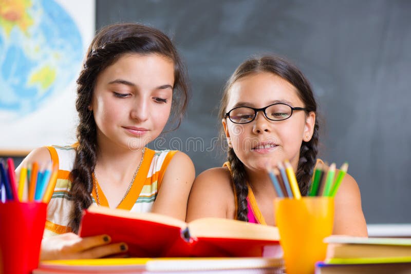 Portrait of Two Beautiful Schoolgirl in Classroom Stock Photo - Image ...