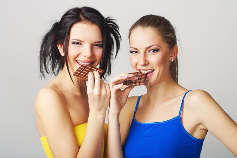 Portrait of Two Beautiful Women, Eating Chocolate Stock Image - Image ...