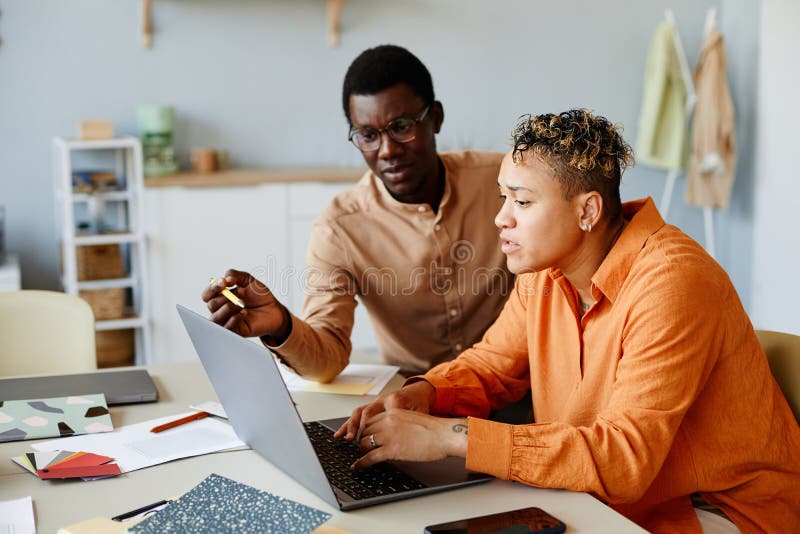 Two Black Business People Using Laptop in Office Stock Photo - Image of ...