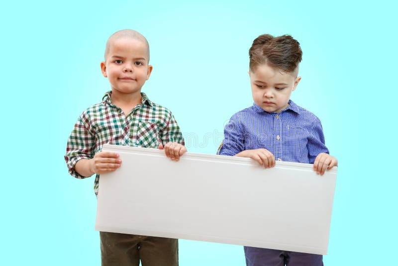 Portrait of Two Boys Holding White Sign on Isolated Background Stock ...