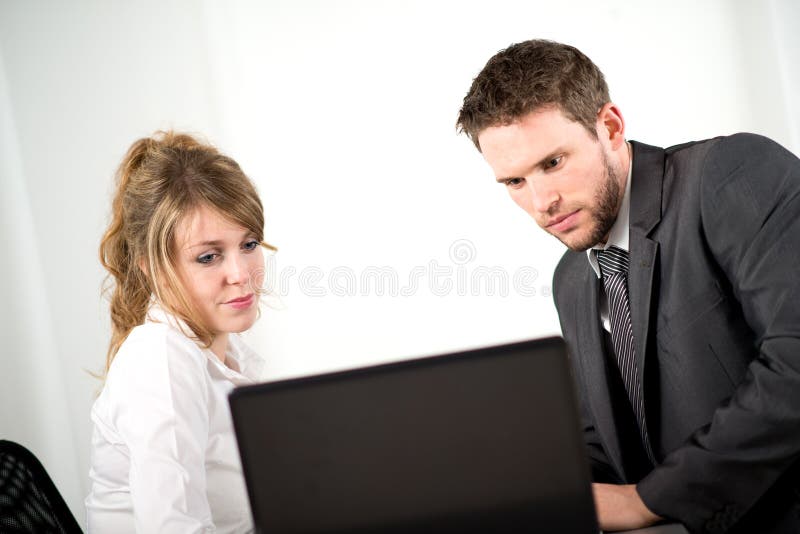 Portrait of Two Business People Working Together in Office with ...