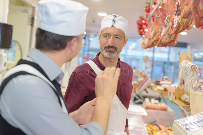 Portrait Two Butchers Talking Stock Photo - Image of senior, beef ...