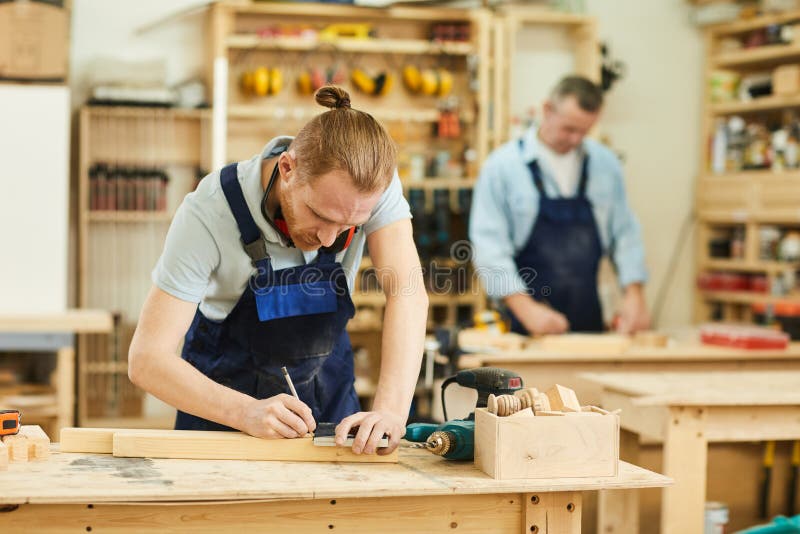 Two Workers in Carpentry stock image. Image of making - 148160231