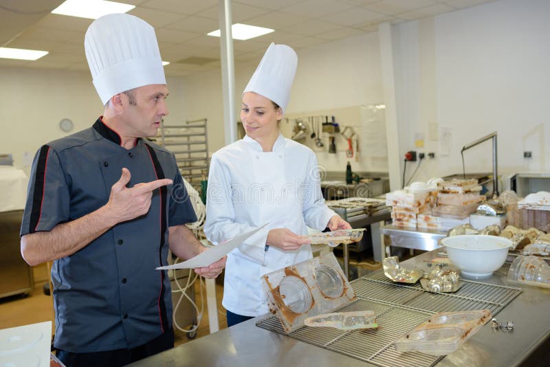 Portrait Two Chefs in Cook Uniform in Kitchen Stock Photo - Image of ...