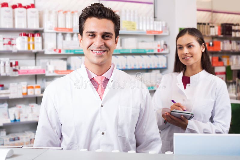 Portrait of Two Friendly Pharmacists Working Stock Photo - Image of ...