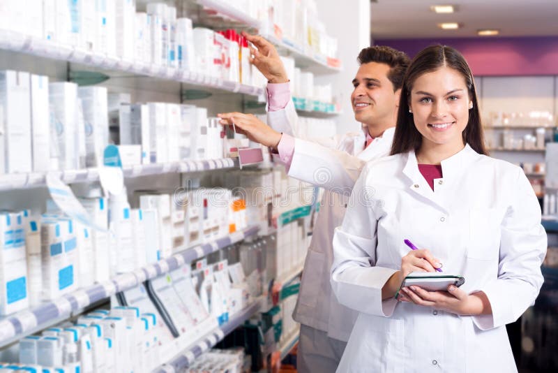 Portrait of Two Friendly Pharmacists Working Stock Image - Image of ...