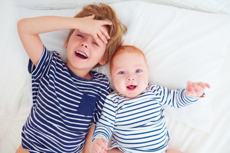 Portrait of Two Funny Brothers Laying in Bed Stock Image - Image of ...