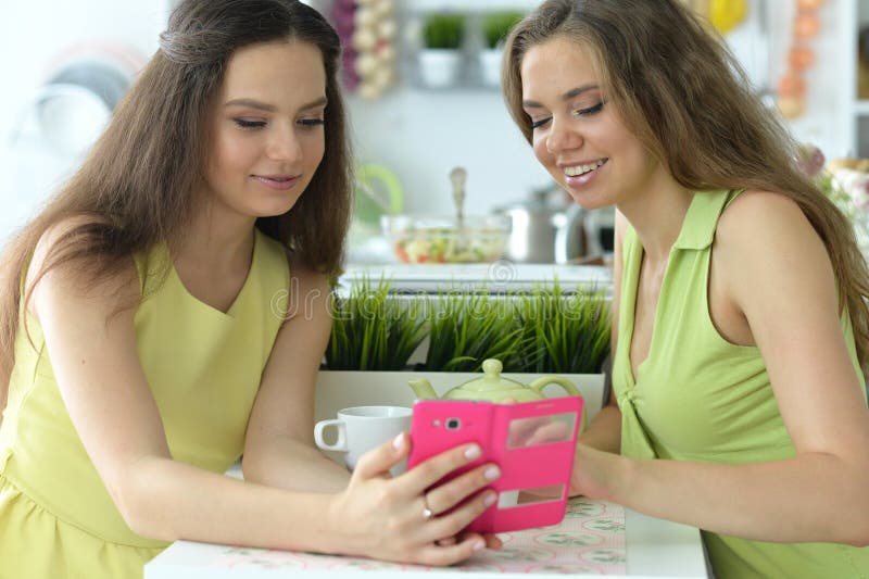 Portrait of a Two Girls Using Smartphone Stock Image - Image of front ...