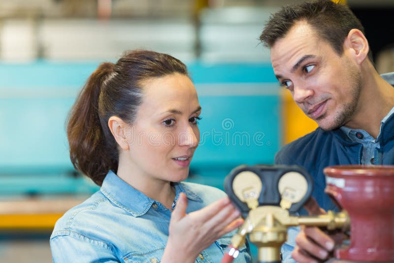 Portrait Two Glad Workers Taking Notes While Discussing Something Stock Image Image Of Notes