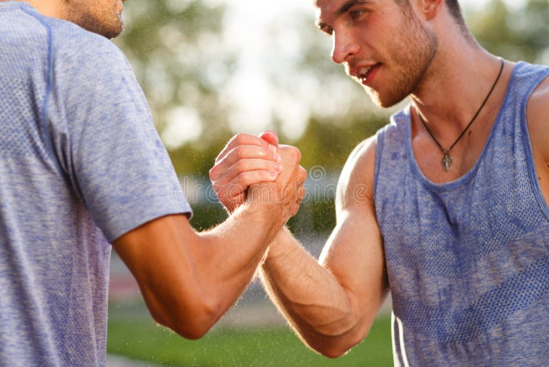Portrait of Two Handsome Strong Men Handshake. Focused on Hands Stock ...