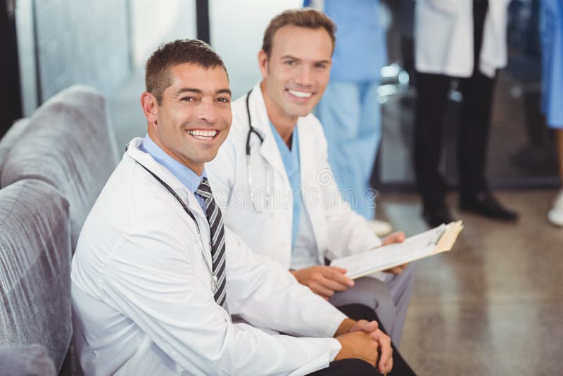 Portrait of Two Happy Doctors with Clipboard Stock Photo - Image of ...