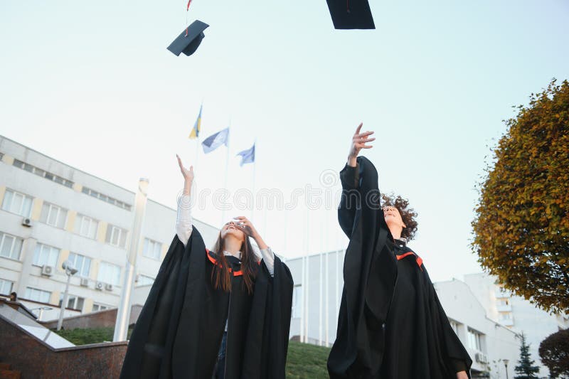 Portrait of Two Happy Graduating Students. Stock Image - Image of ...