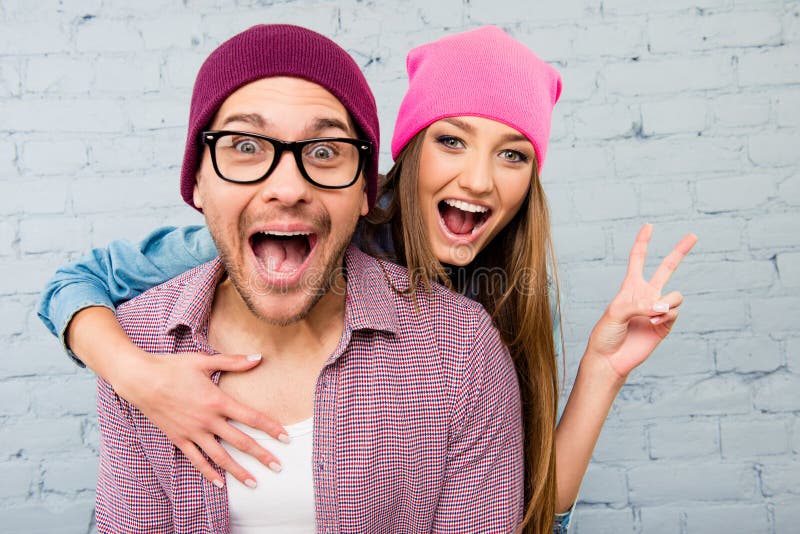 Portrait of Two Happy Lovers in Caps Huging and Screaming Stock Image ...
