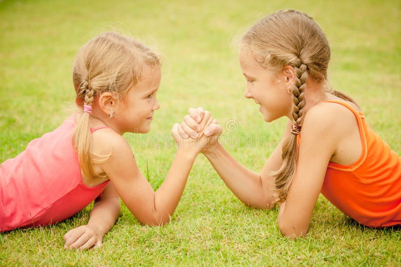 Portrait of Two Happy Sister Playing on the Grass Stock Photo - Image ...