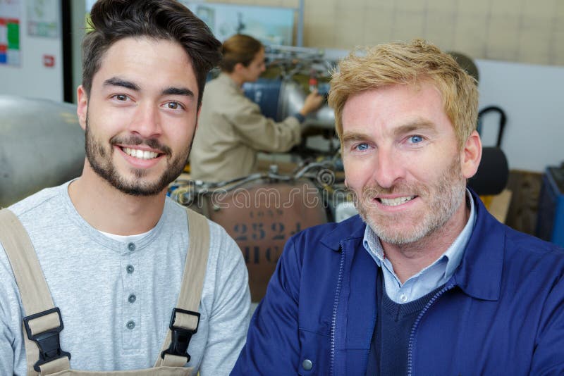 Portrait two happy workers stock photo. Image of factory - 239075034