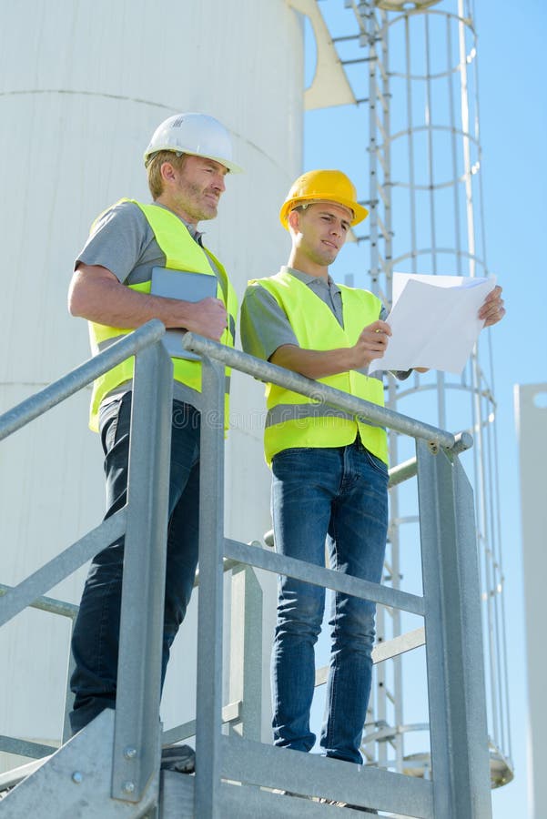 Portrait Two Industrial Workers in Factory Stock Photo - Image of ... Portrait Two Industrial Workers in Factory Stock Photo - Image of ...
