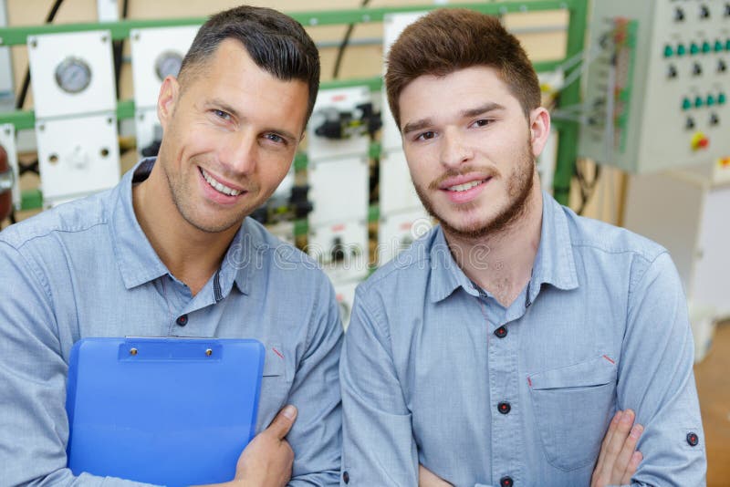 Portrait Two Men Working in Workshop Stock Image - Image of pipefitting ...
