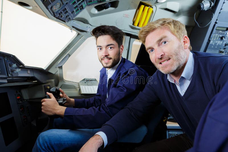 Portrait Two Pilots Flying Jet Airliner Stock Image - Image of white ...