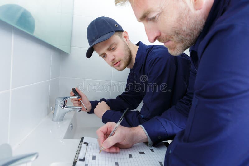 Portrait Two Plumbers with Clipboard Stock Image - Image of home ...
